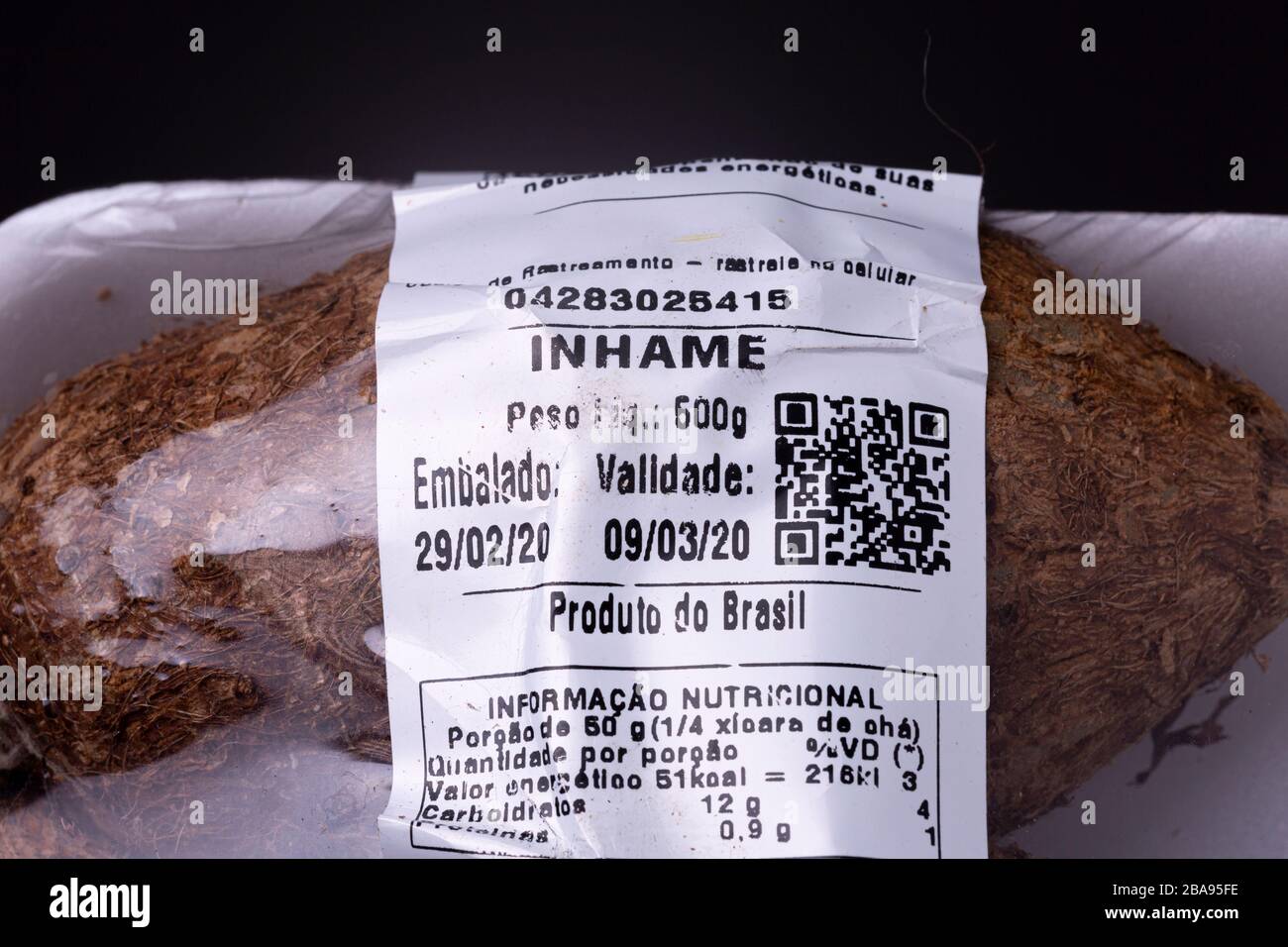 Label on packed Brazilian Inhame or Yam in plastic wrap on white ...
