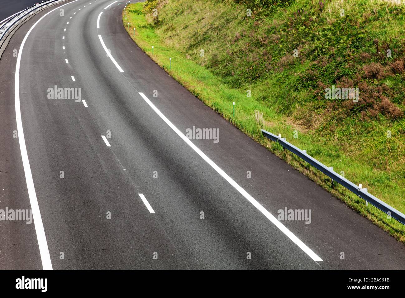 asphalt road through the green field Stock Photo - Alamy