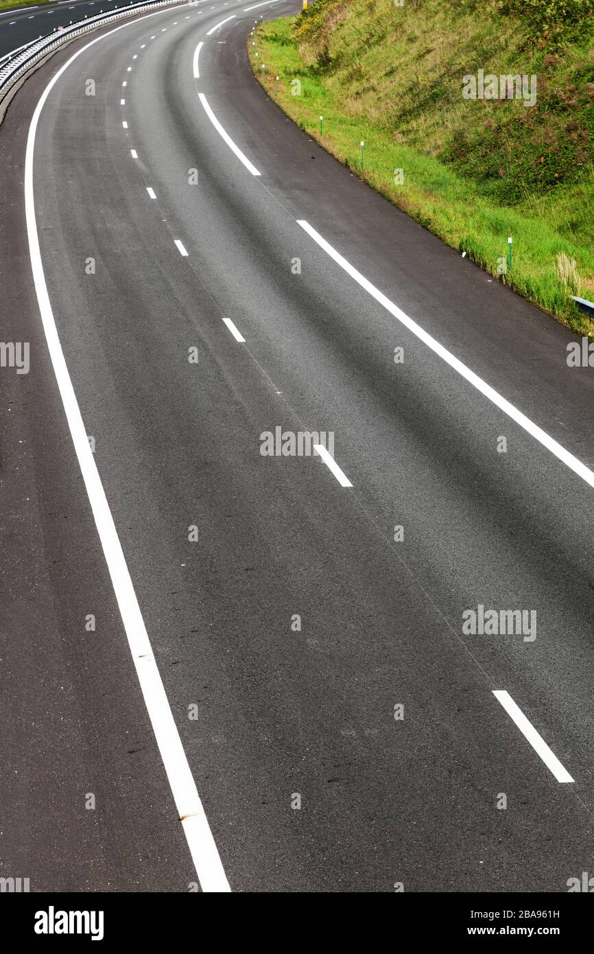 asphalt road through the green field Stock Photo - Alamy