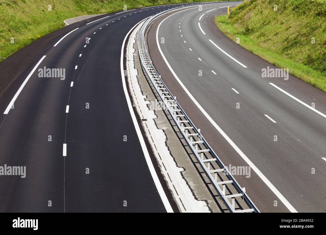 asphalt road through the green field Stock Photo - Alamy