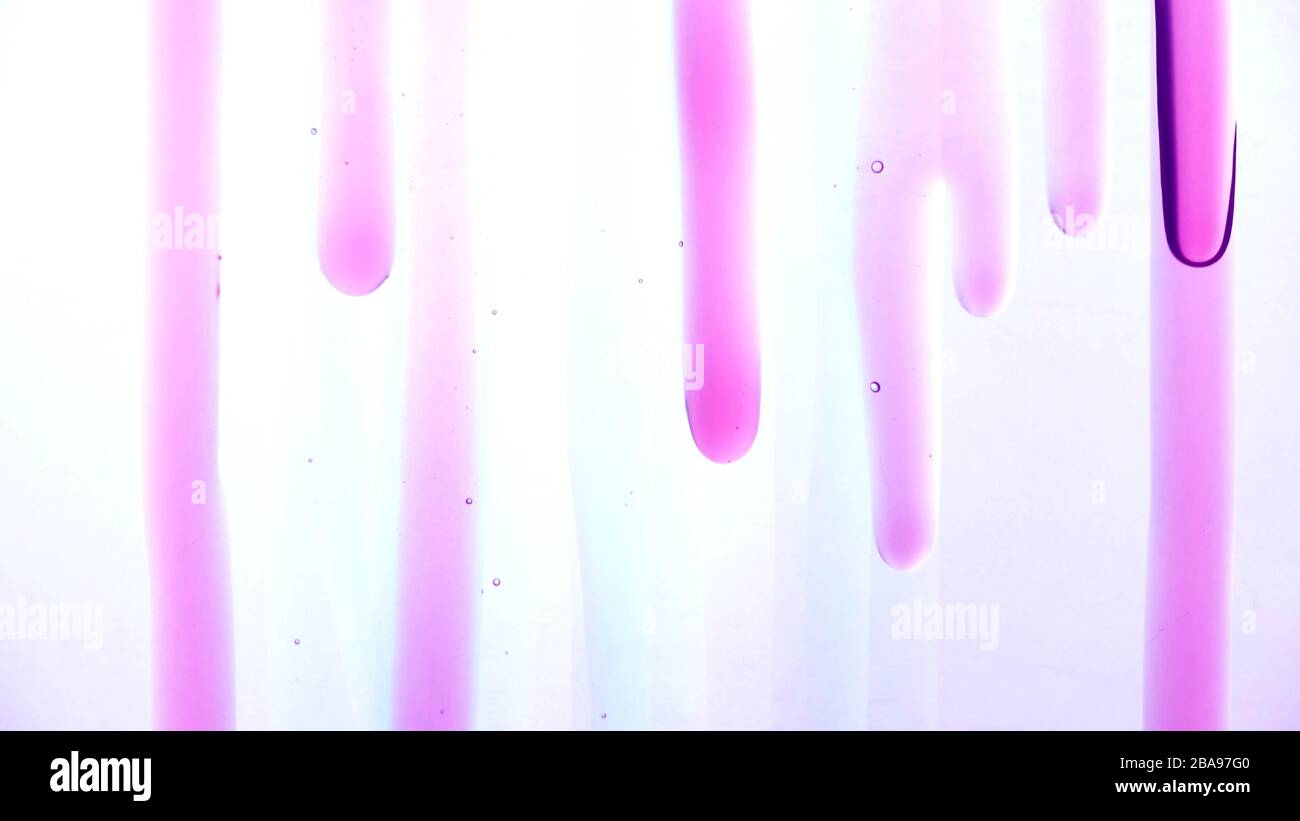 Slowly dripping purple oil transparent liquid Stock Photo - Alamy