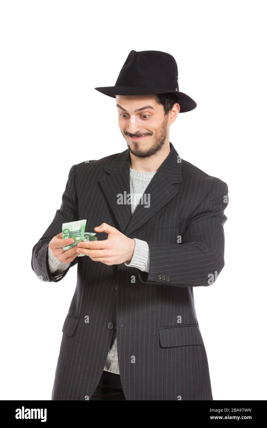 young man with hat counts the money, isolated over white background ...