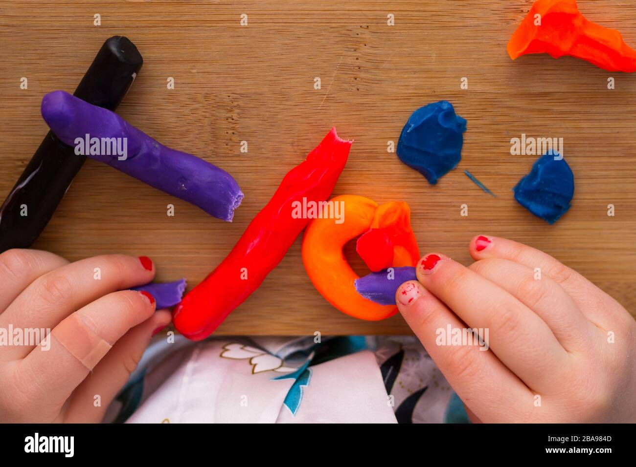child playing with plasticine and making molds Stock Photo - Alamy