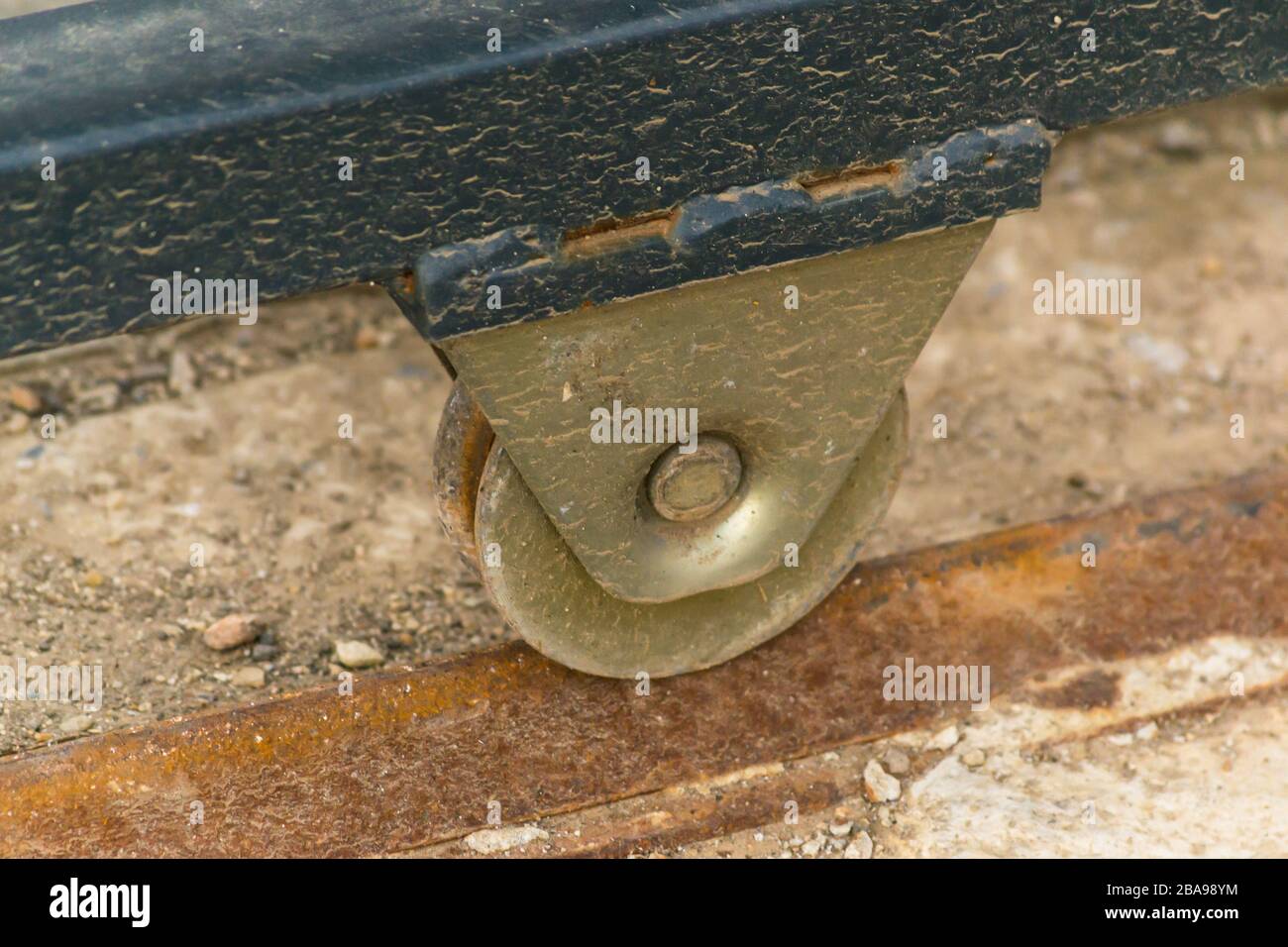 close-up photo of a golden wheel on rusty rail Stock Photo - Alamy