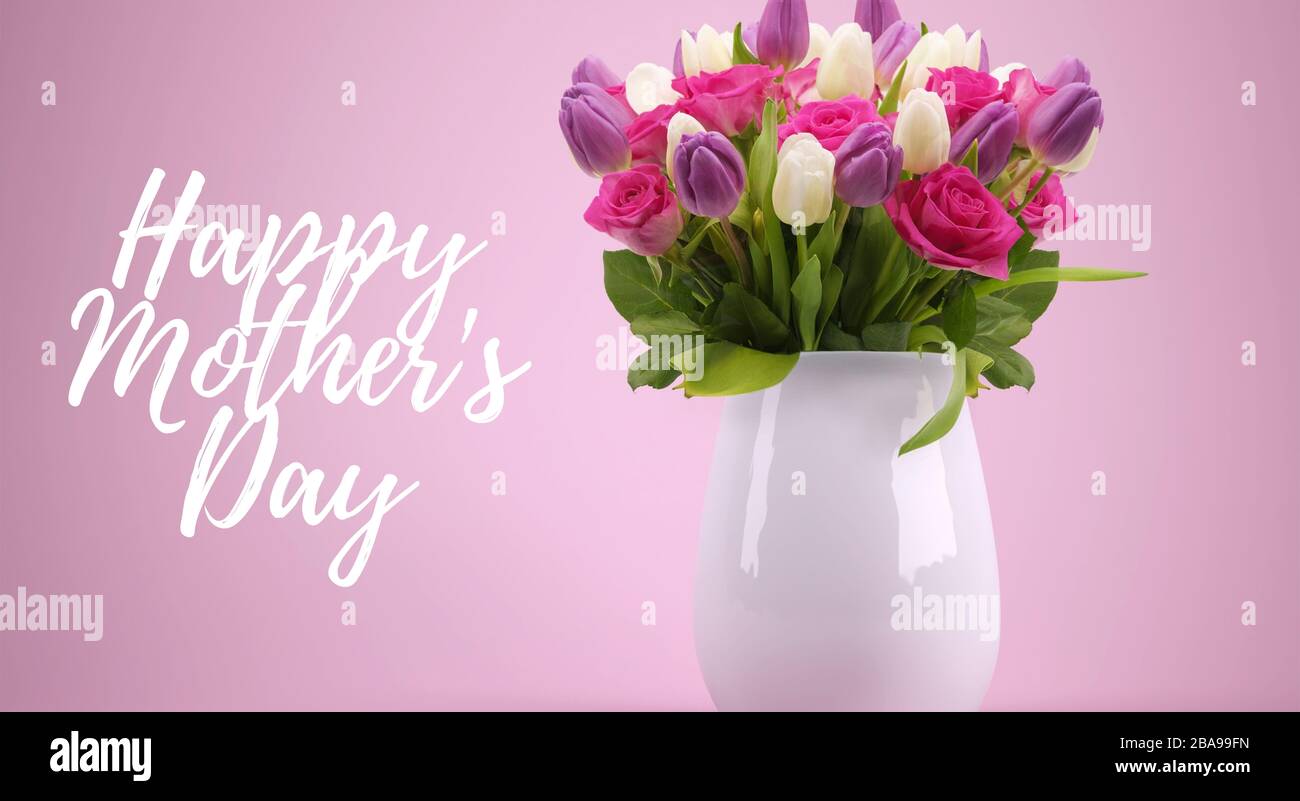 Happy Mothers Day words. Beautiful and tender bouquet of flowers in the ...