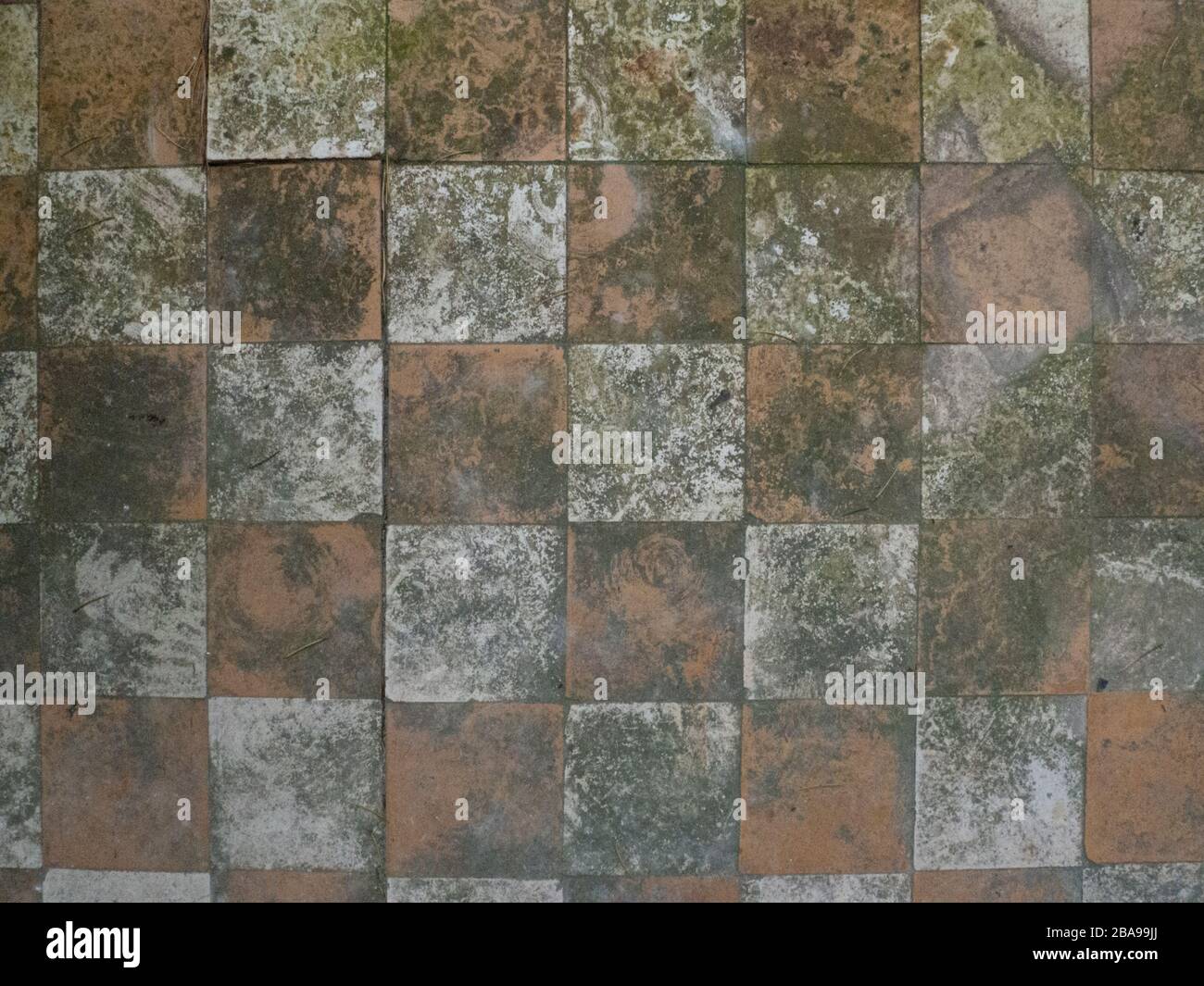 Old tiles and textures on decaying house wall Stock Photo - Alamy
