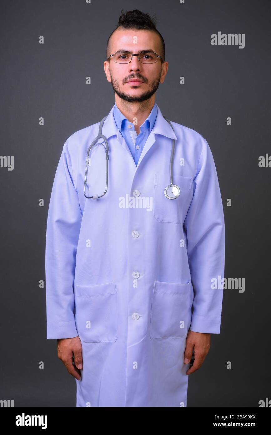 Portrait of handsome bearded Turkish man doctor Stock Photo - Alamy