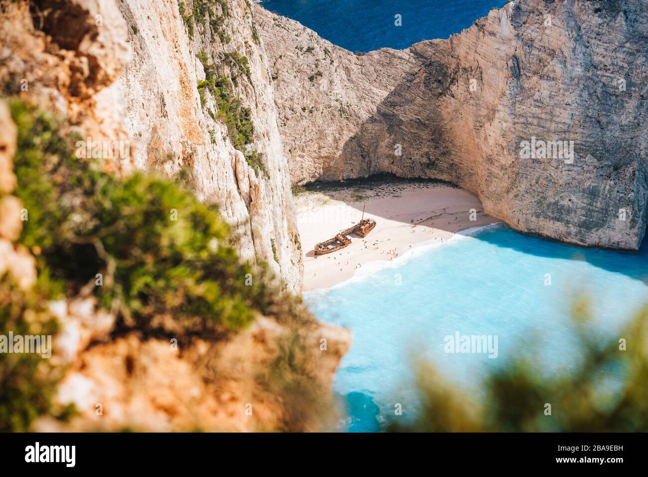 Famous shipwreck on Navagio beach. Blue sea cove surrounded by huge ...