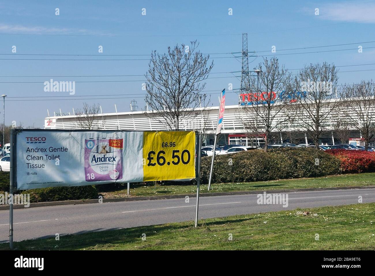 An advert for toilet paper outside Tesco at Galleons Reach, Becton ...