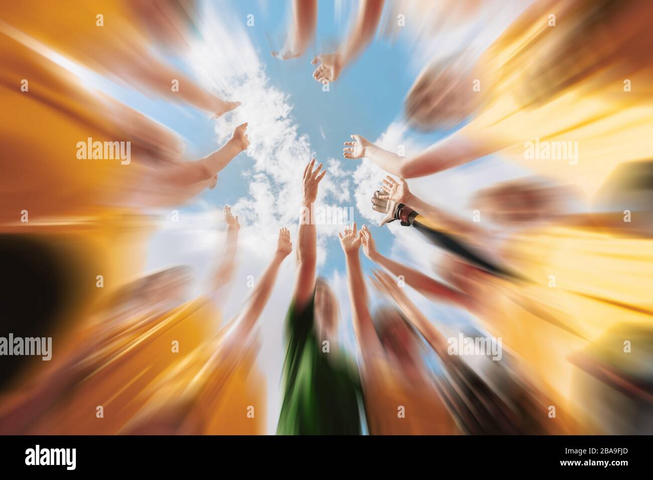 Kids football team stacking hands with coach before a match. Children ...
