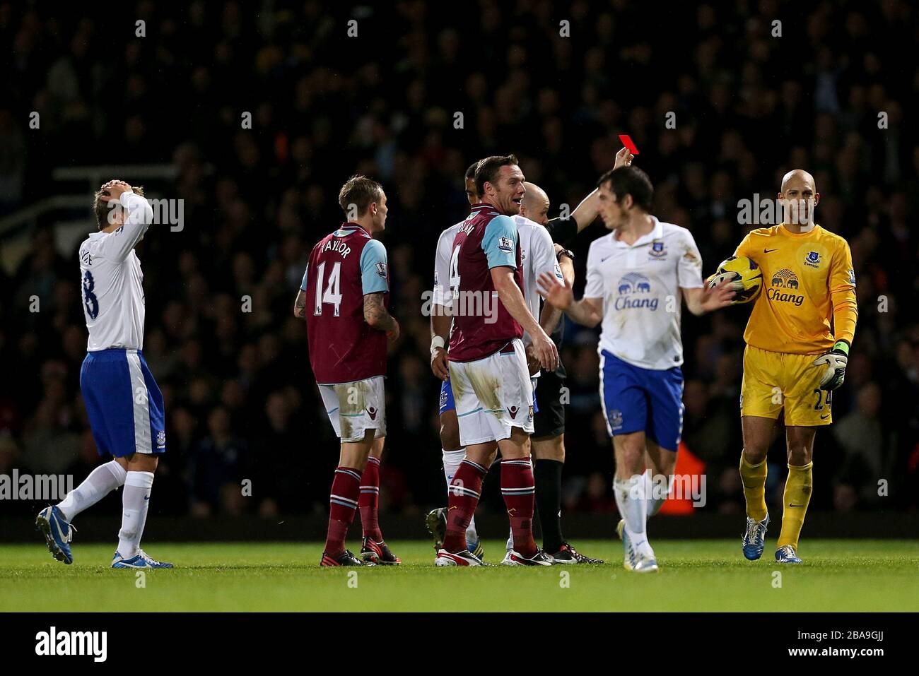 Referee Anthony Taylor shows the red card to West Ham United's Carlton ...