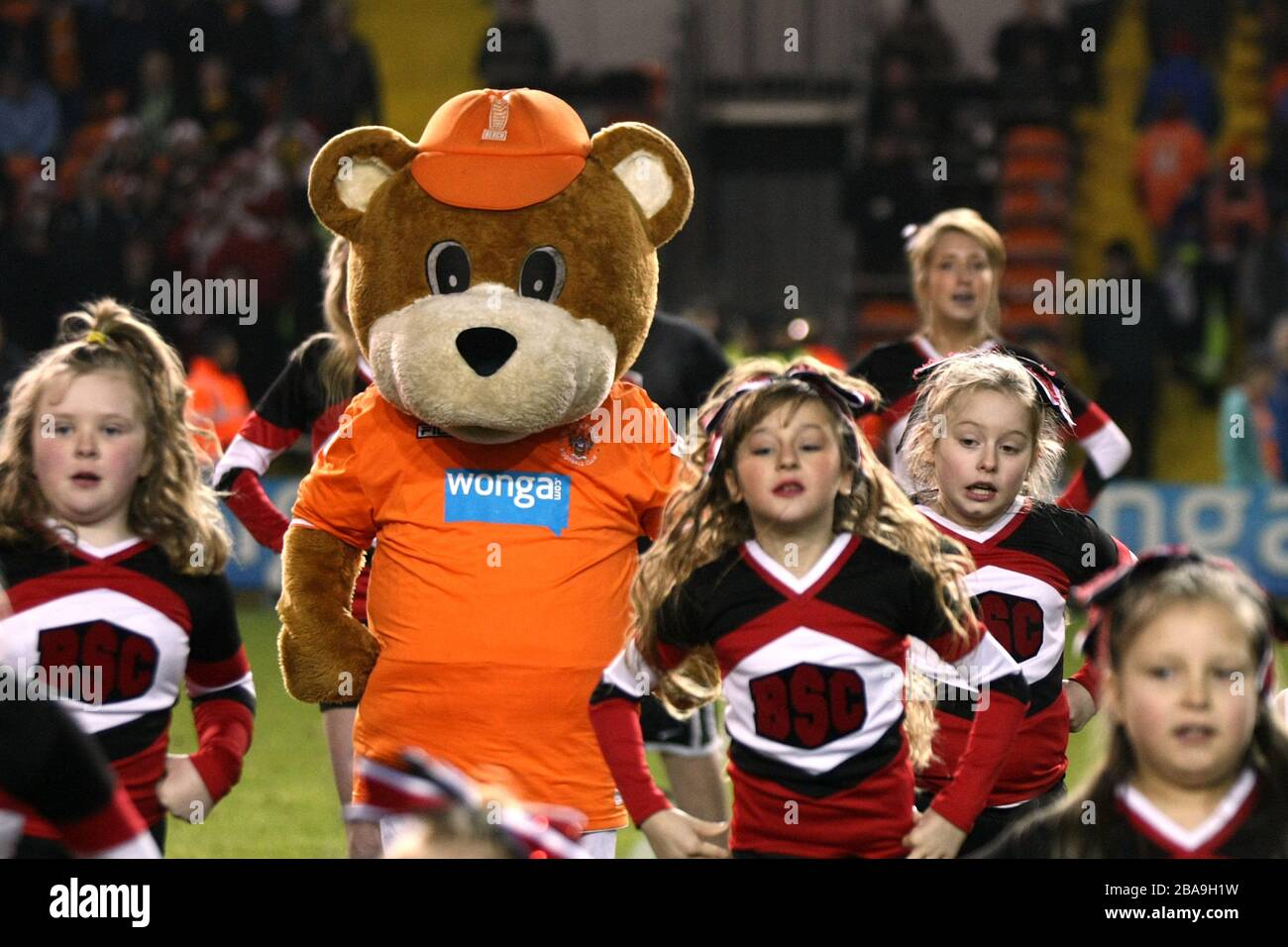 Blackpool's mascot Bloomfield Bear with cheerleaders before kick-off ...