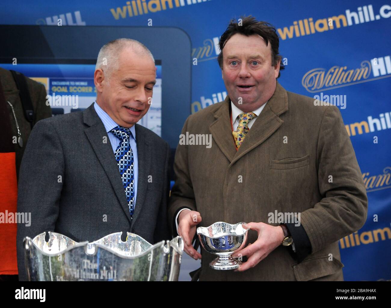 Long Run trainer Nickey Handerson (right) picks up the winning trainer ...