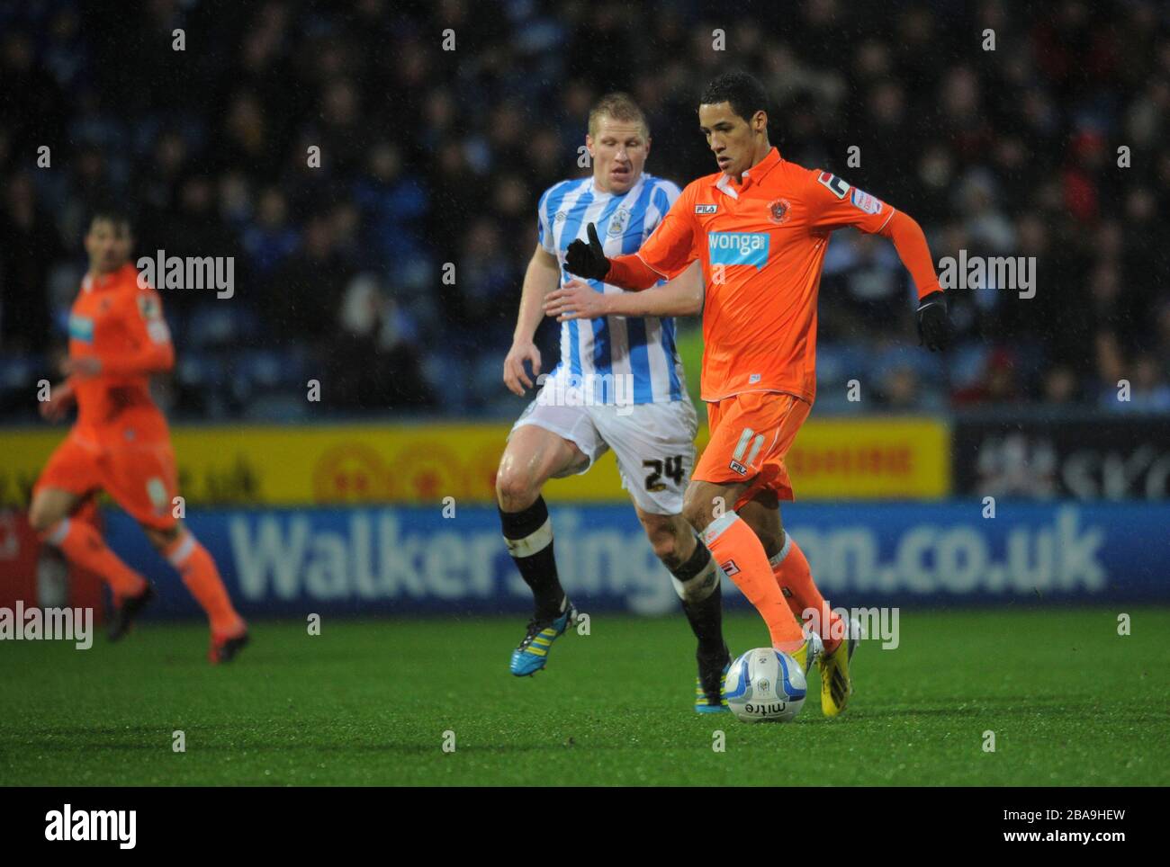 Huddersfield Town's Keith Southern and Blackpool's Tom Ince (right ...