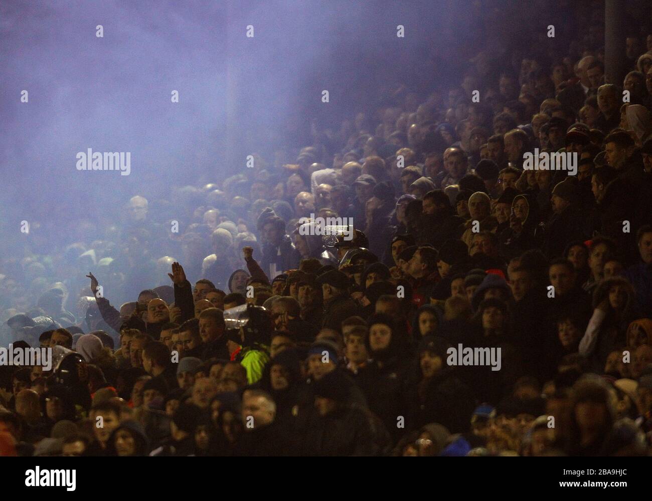 Chelsea fans let off a flare in the stands Stock Photo - Alamy