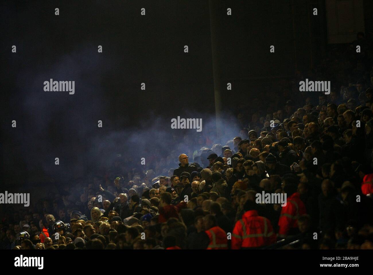 Chelsea fans let off a flare in the stands Stock Photo - Alamy