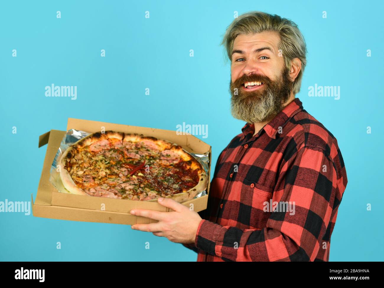 giving food order and holding pizza. hungry man eating pizza. fast food ...