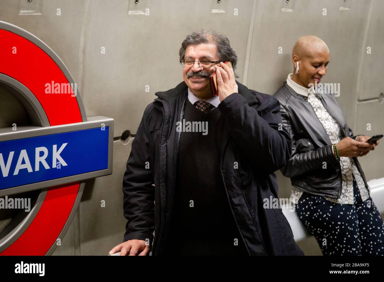 A man makes a phone call on the platform at Southwark Underground ...