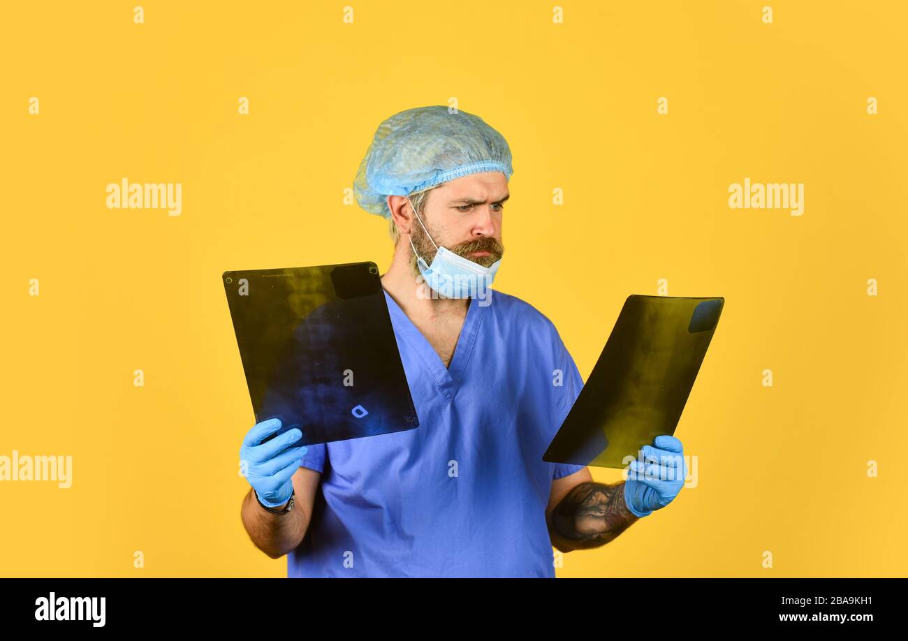 Hospital emergency. Surgeon estimate damages. Doctor uniform. X-ray ...