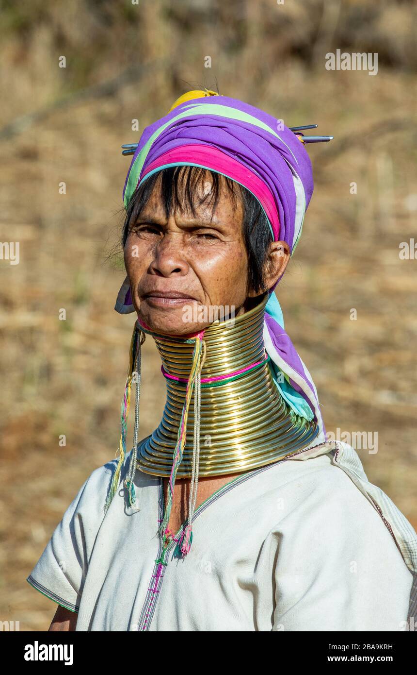 Portrait of Padaung woman in traditional dress and with metal rings ...