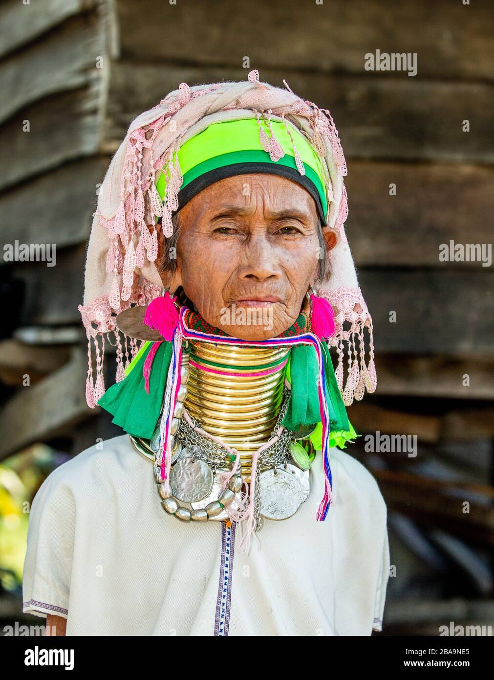 Portrait of an old Padaung woman in traditional dress and with metal ...