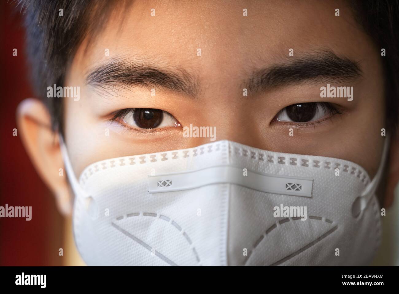 Wearing a mask of boy image features Stock Photo - Alamy