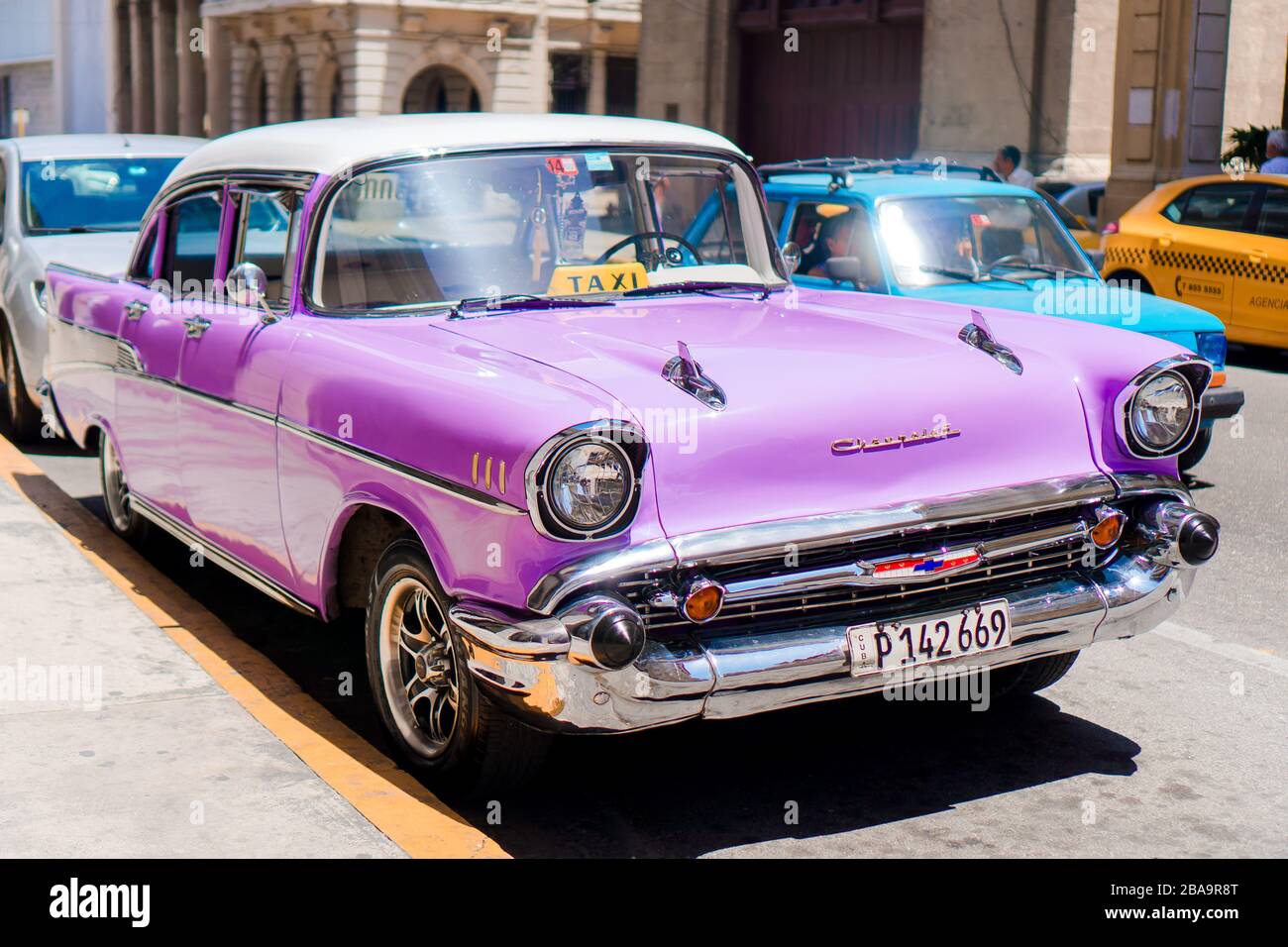 View of yellow classic vintage car in Old Havana, Cuba Stock Photo - Alamy