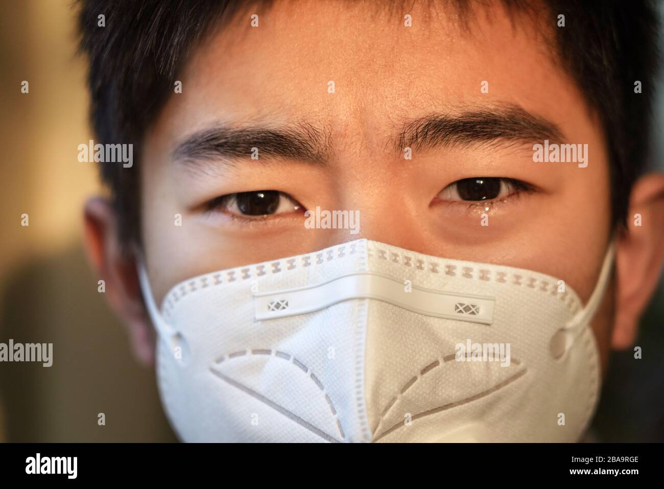 Wearing a mask of boy image features Stock Photo - Alamy