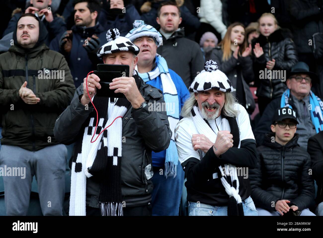Coventry City fans celebrate in the stands Stock Photo - Alamy