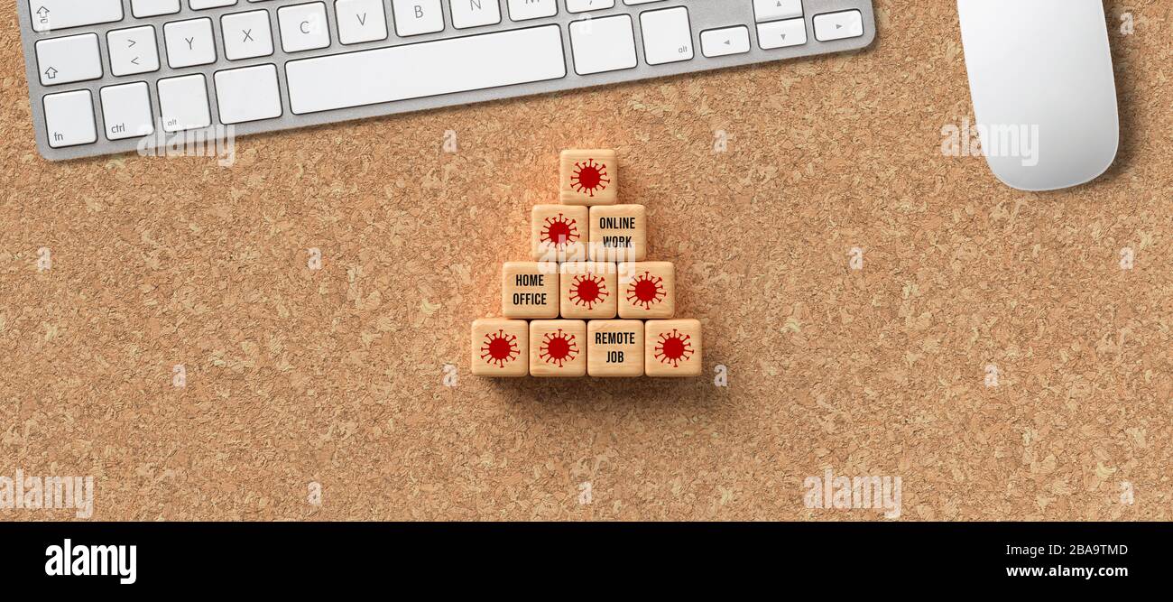 cubes with text HOME OFFICE at a computer workplace on cork background ...