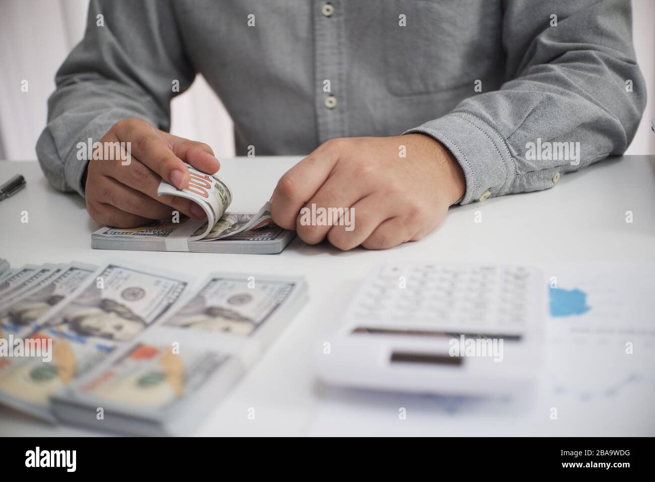Unrecognisable businessman, accountant, banker counting money at the ...