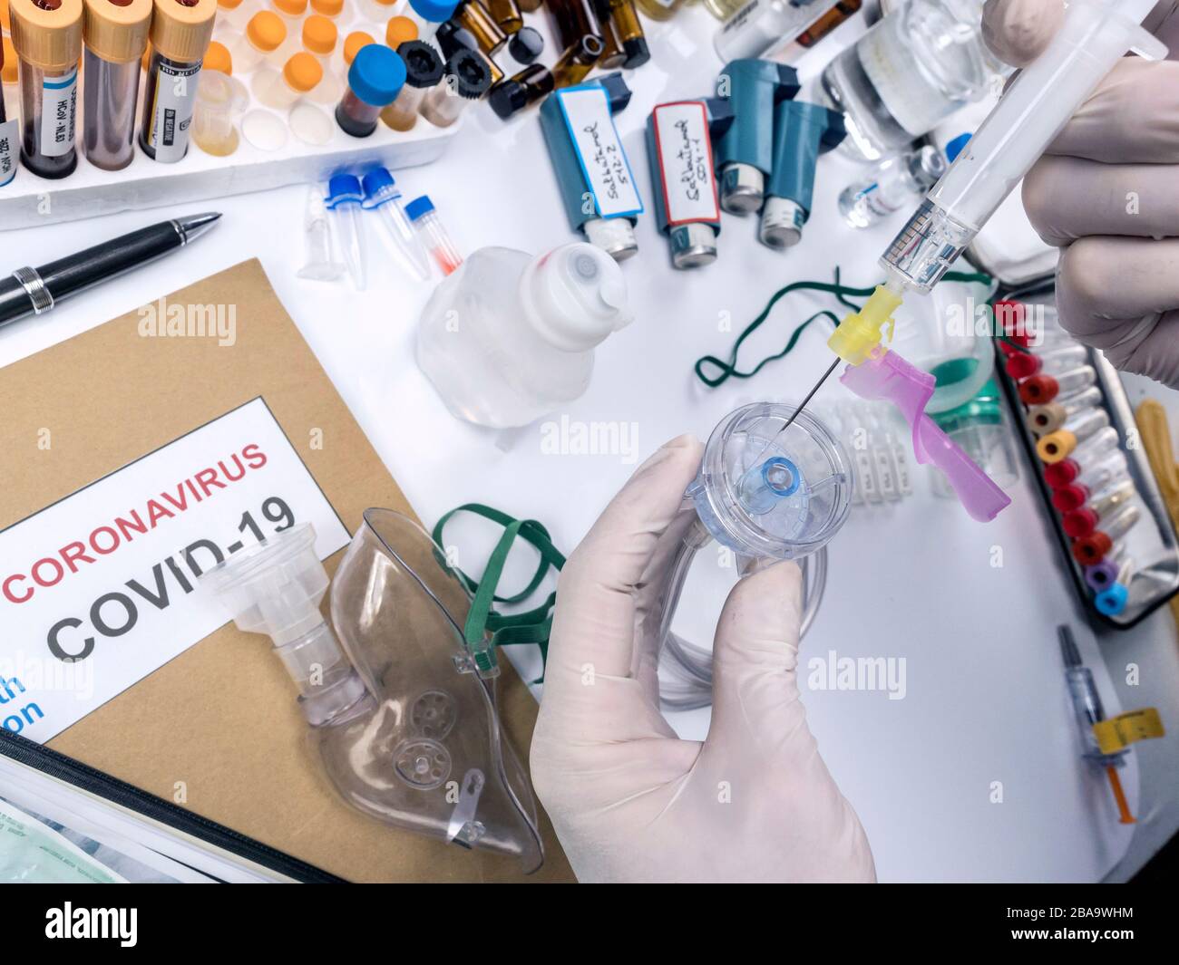 Nurse refilling medication solution nebulizer container Stock Photo - Alamy
