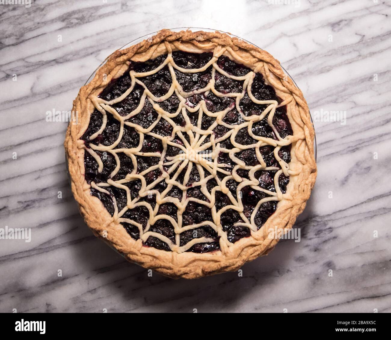 Blueberry Pie with Spiderweb Lattice Crust on Marble Pastry Board Stock ...