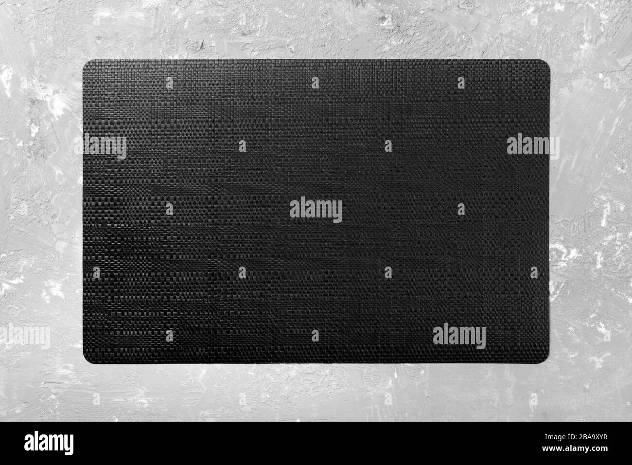 Top view of empty black tablecloth on cement background with copy space ...