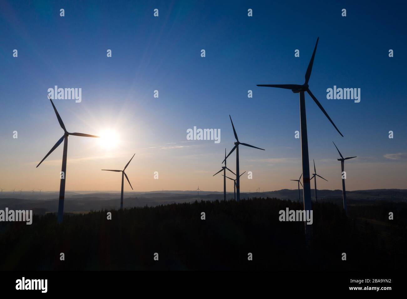 Wind wheels in the evening light hi-res stock photography and images ...