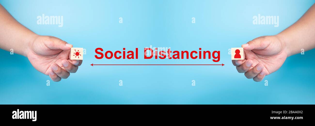 Man hand hold wooden cube on hospital blue background banner with word ...