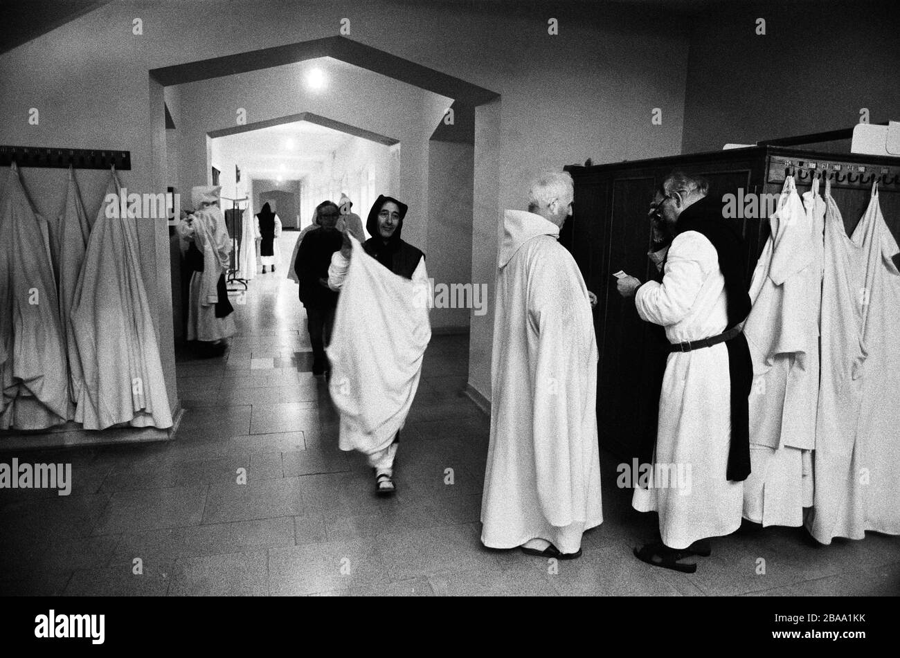 Monks disrobing after evening prayers in the chapel at Sancta Maria ...
