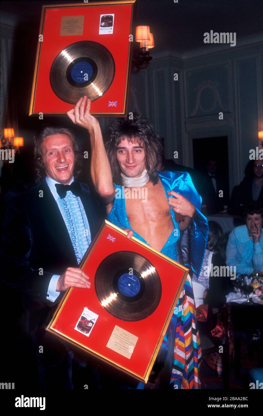 Rod Stewart of The Faces being presented with Gold Disks by footballer ...