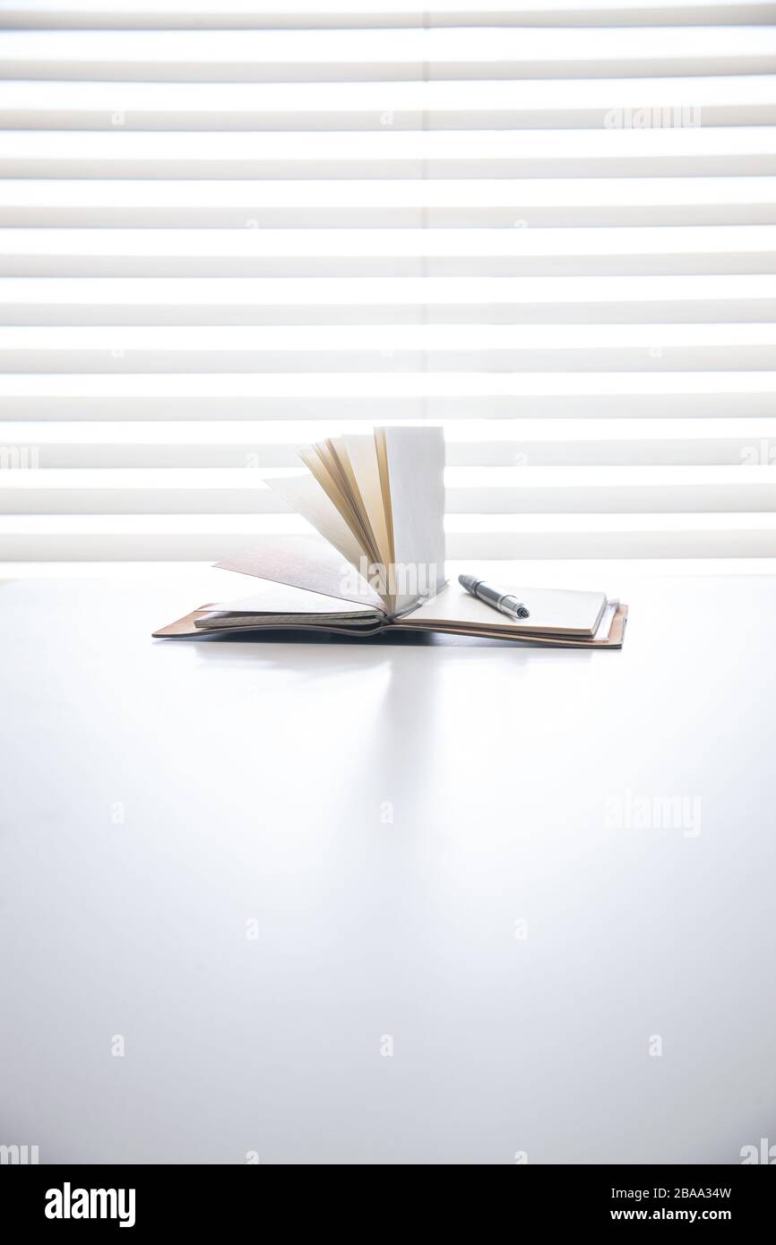 Notebook on the desk Stock Photo - Alamy