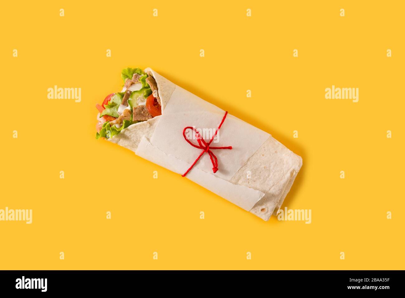 Doner kebab or shawarma sandwich isolated on yellow background. Top ...