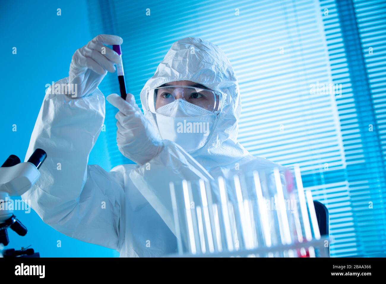 Medical workers with test tubes for testing Stock Photo - Alamy