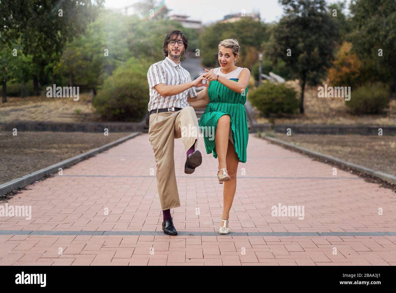 Swing dancers having fun outdoors in the park. Lifestyle concept about ...
