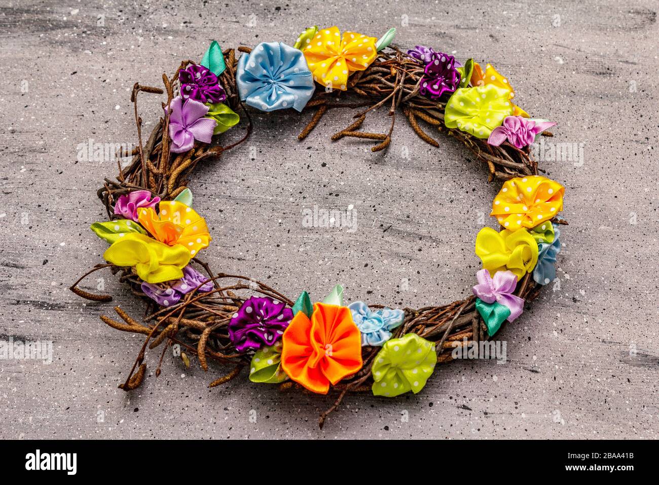 Spring composition of a wreath of birch branches and craft colorful ...