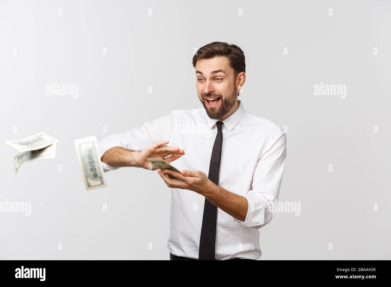 Happy businessman throwing out money hi-res stock photography and ...
