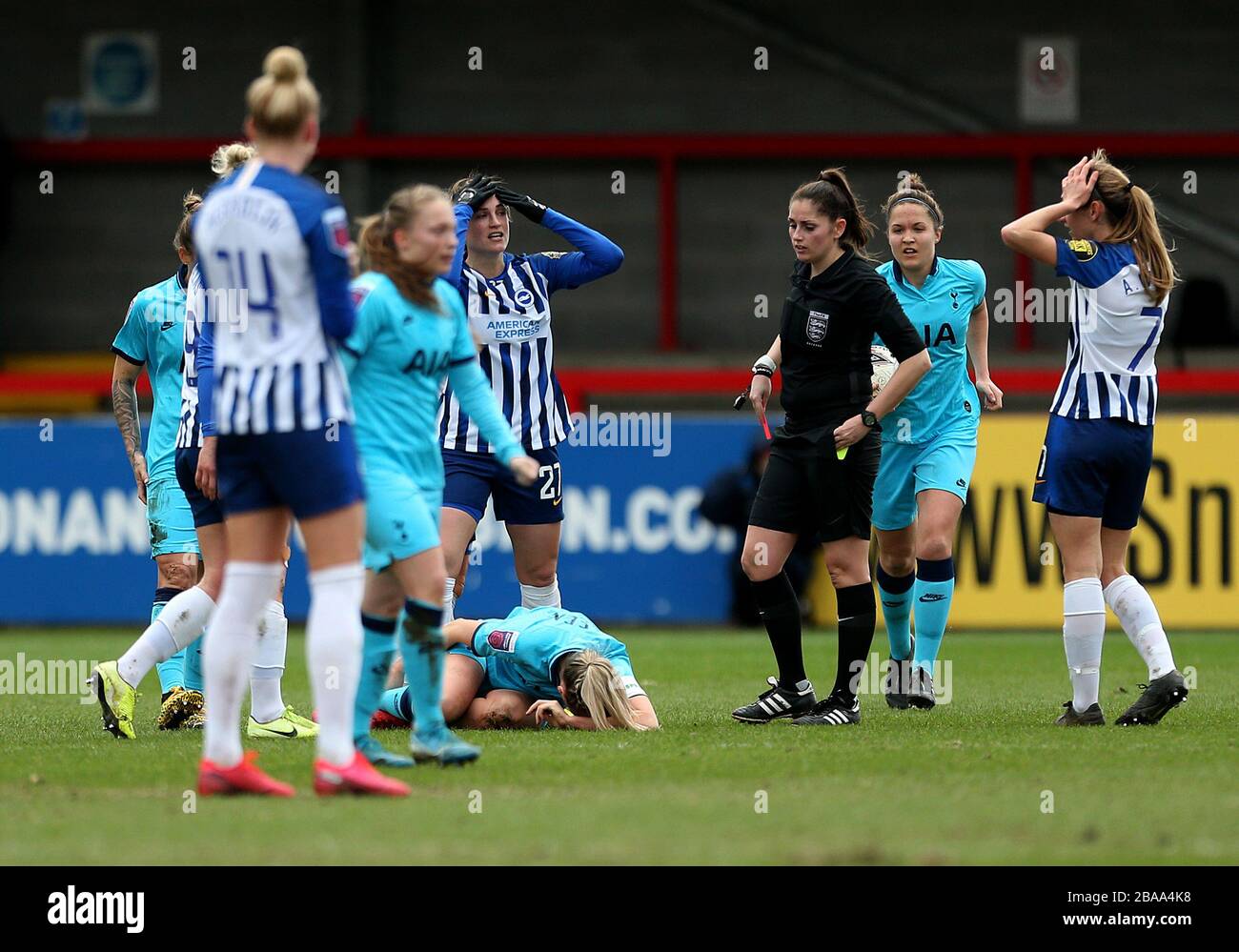 Brighton and Hove Albion Lea Le Garrec (centre) is shown a second ...
