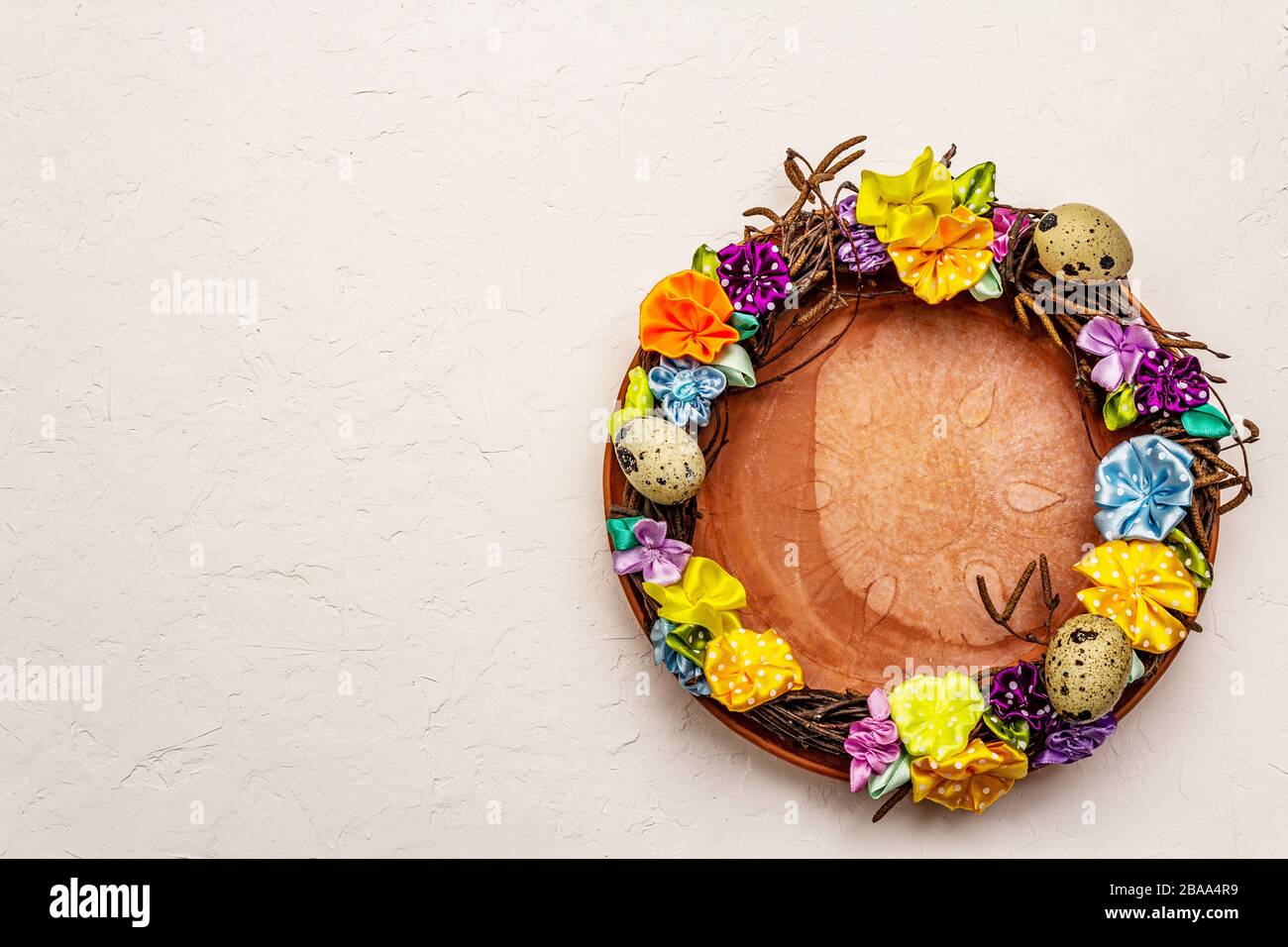 Festive Easter table setting. Hand crafted Easter wicker wreath with ...