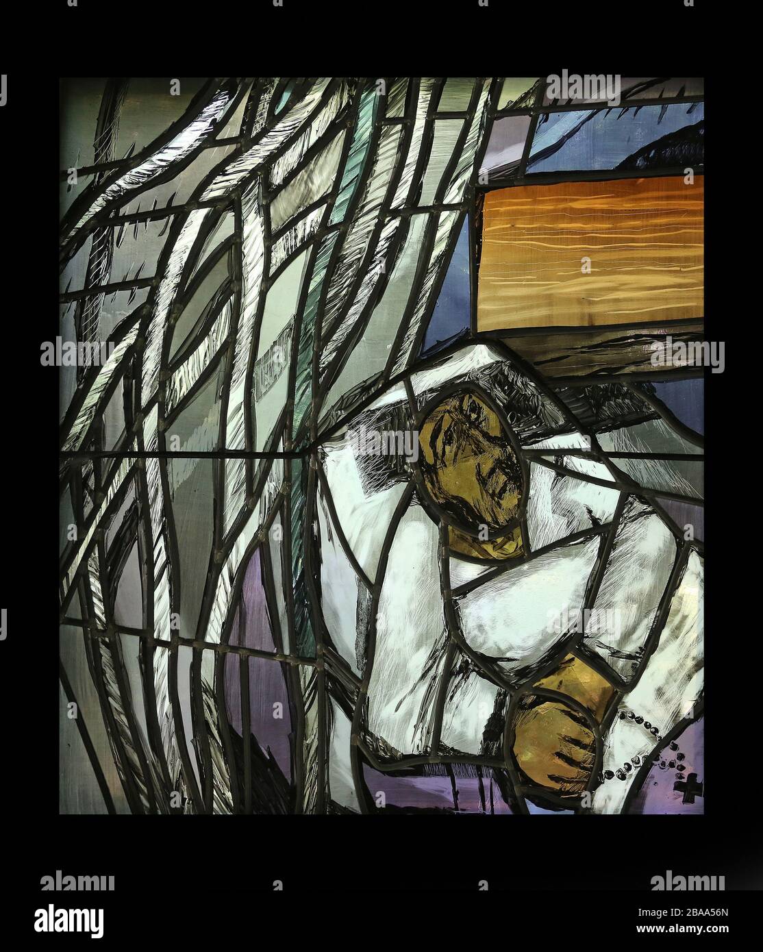 Simon of Cyrene carries the cross, detail of stained glass window by ...