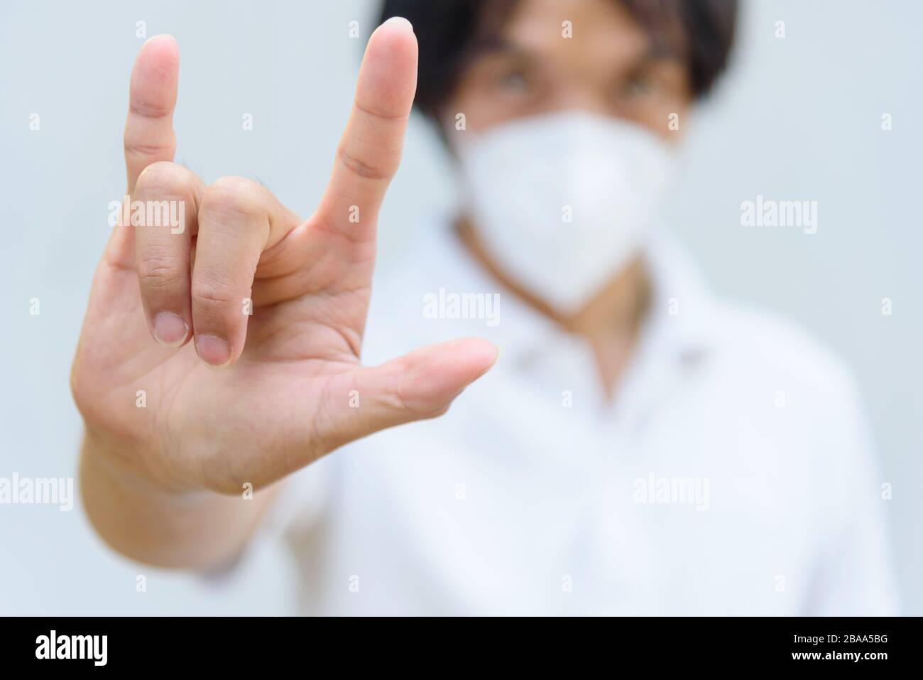A asian man make LOVE sign from his finger Stock Photo - Alamy