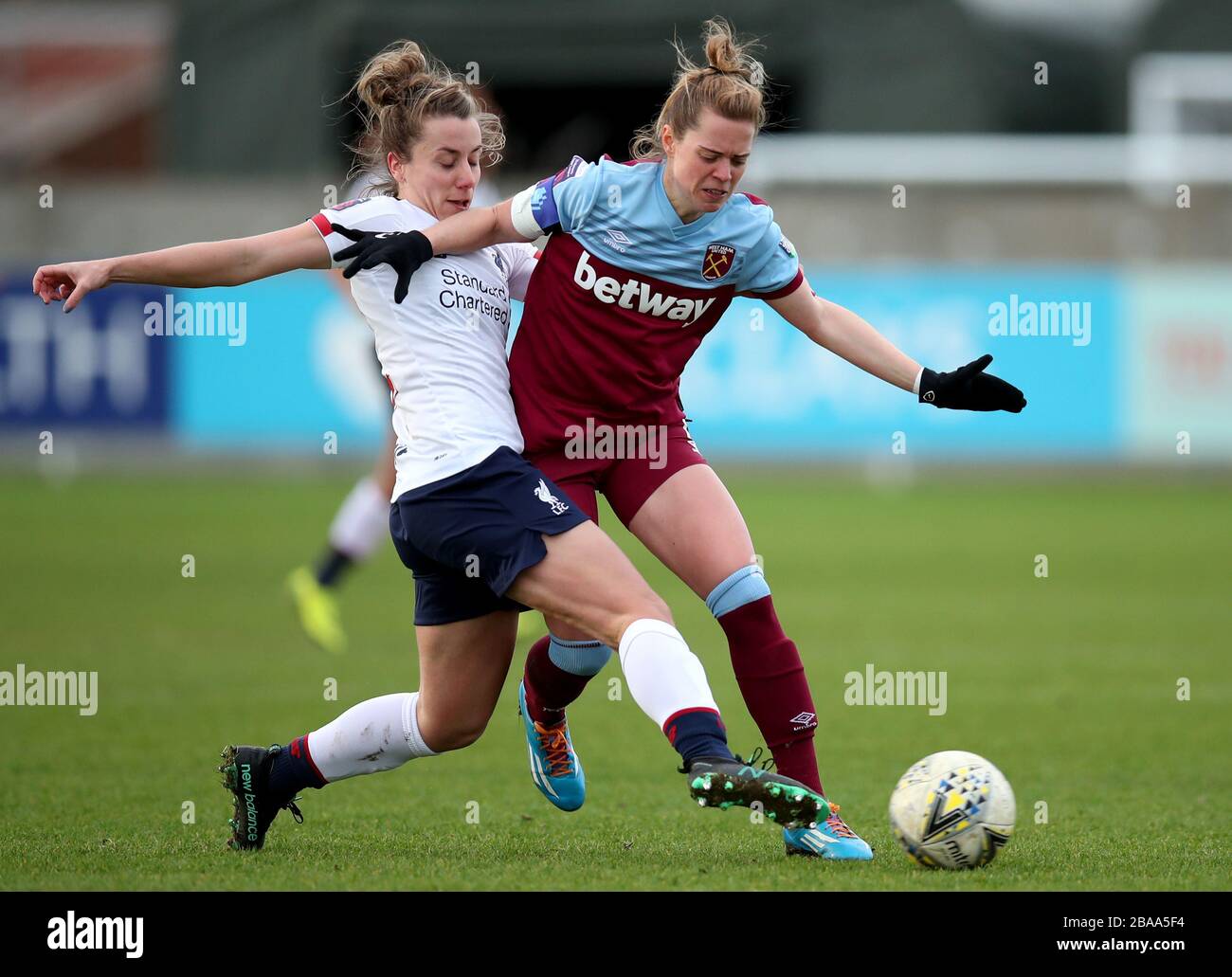 West Ham United's Katharina Baunach and Liverpool's Becky Jane during ...