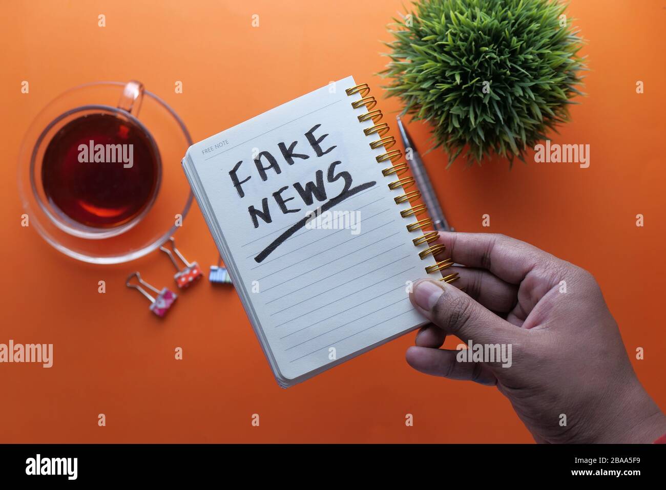 fake news written on notepad, close up Stock Photo - Alamy